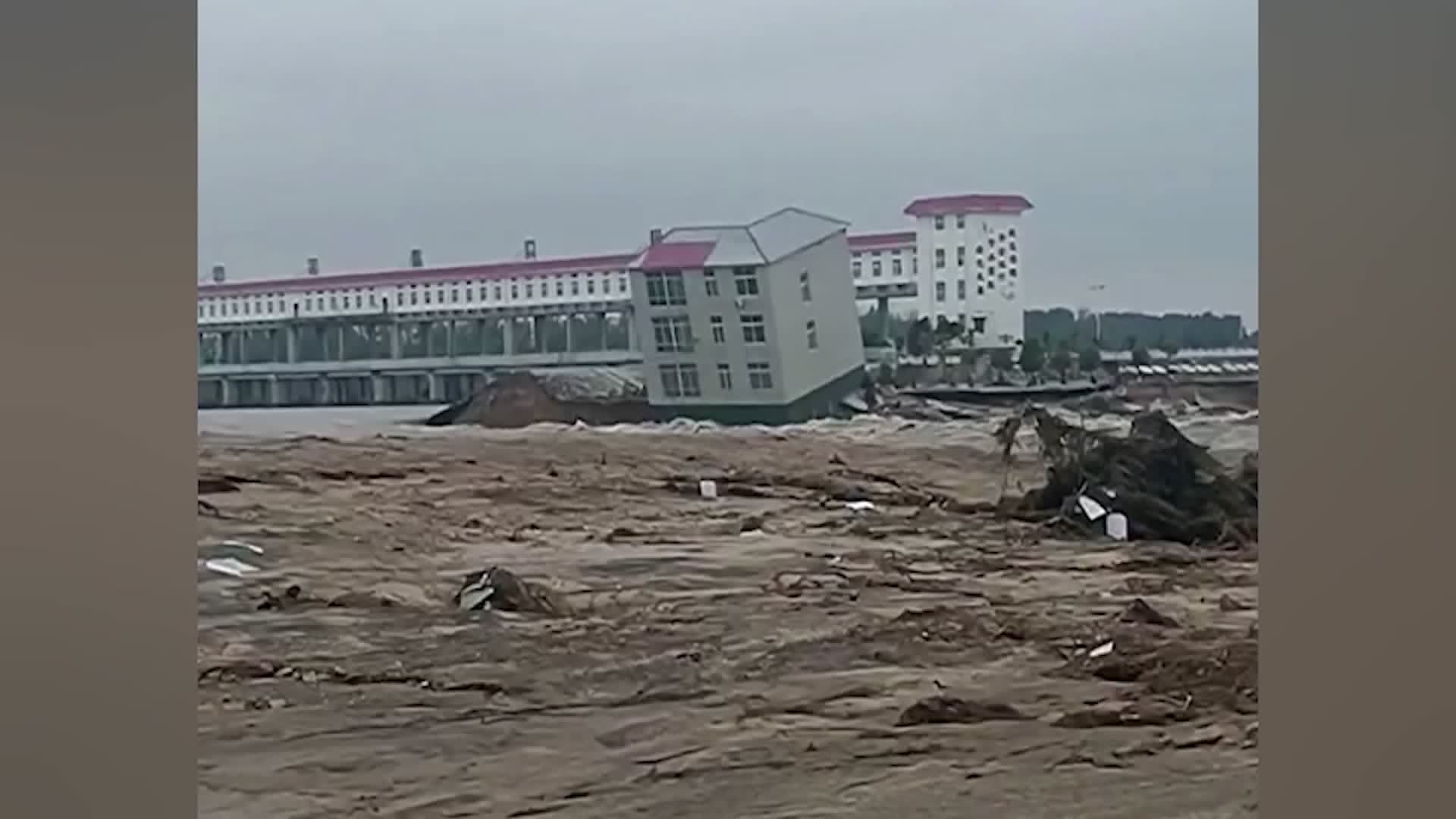Watch as Building Crumbles Amid Floodwaters - Videos from The Weather ...