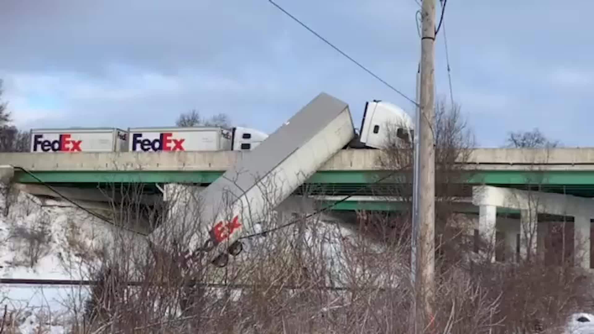Crash Leaves Semi Dangling Off Overpass - Videos from The Weather Channel
