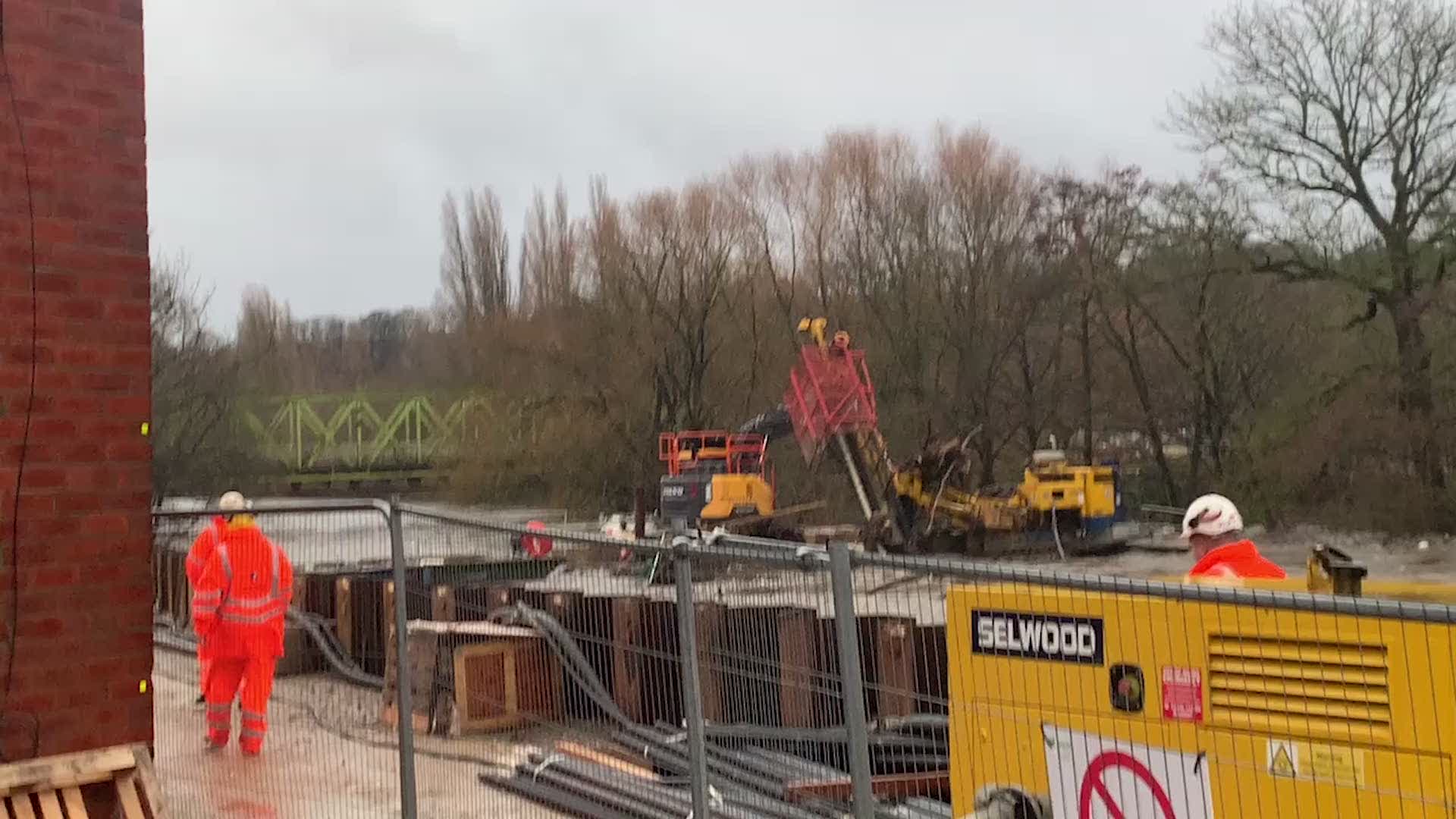 Watch: Floodwaters Send Backhoe Crashing into Bridge - Videos from The ...
