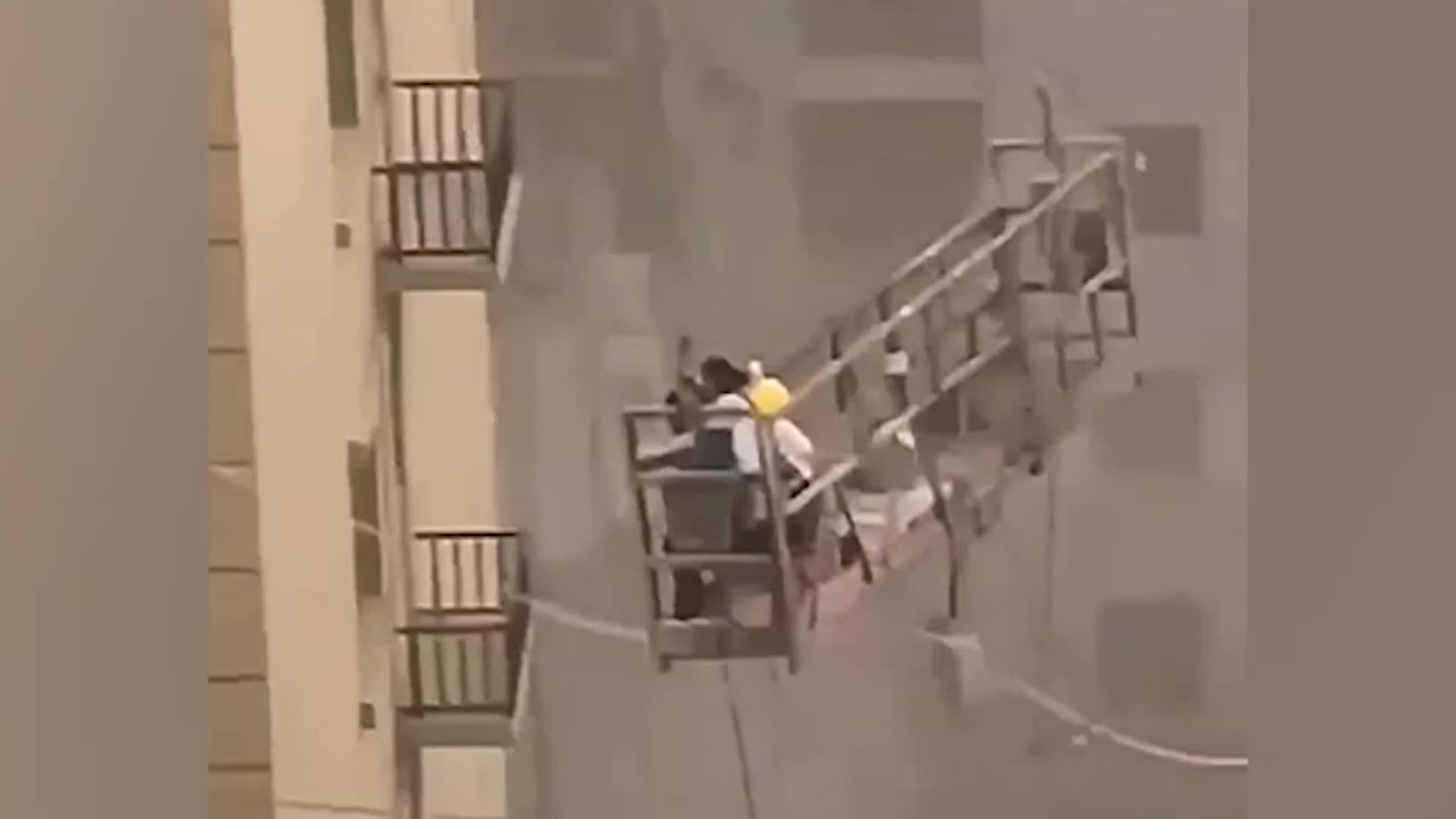 Two Construction Workers On Platform Spin Uncontrollably From Powerful ...