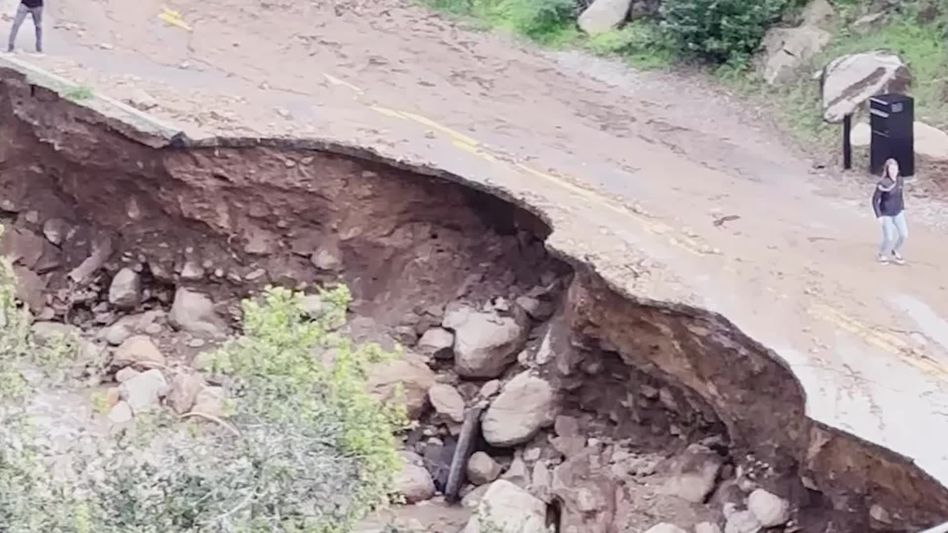 Chunks of Road Collapse Feet From Her - Videos from The Weather Channel