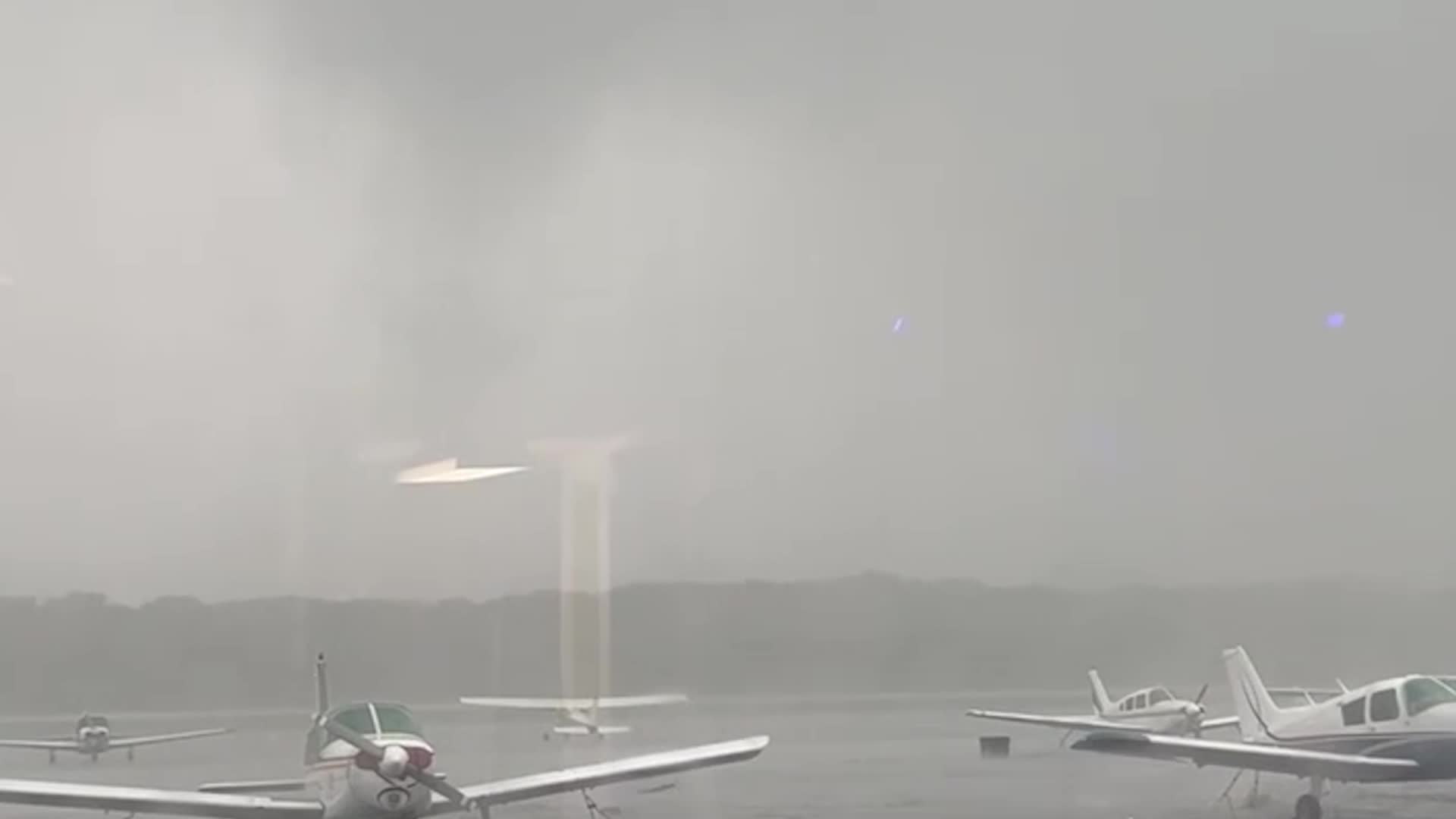 Watch: Funnel Cloud Approaches Airport - Videos from The Weather Channel